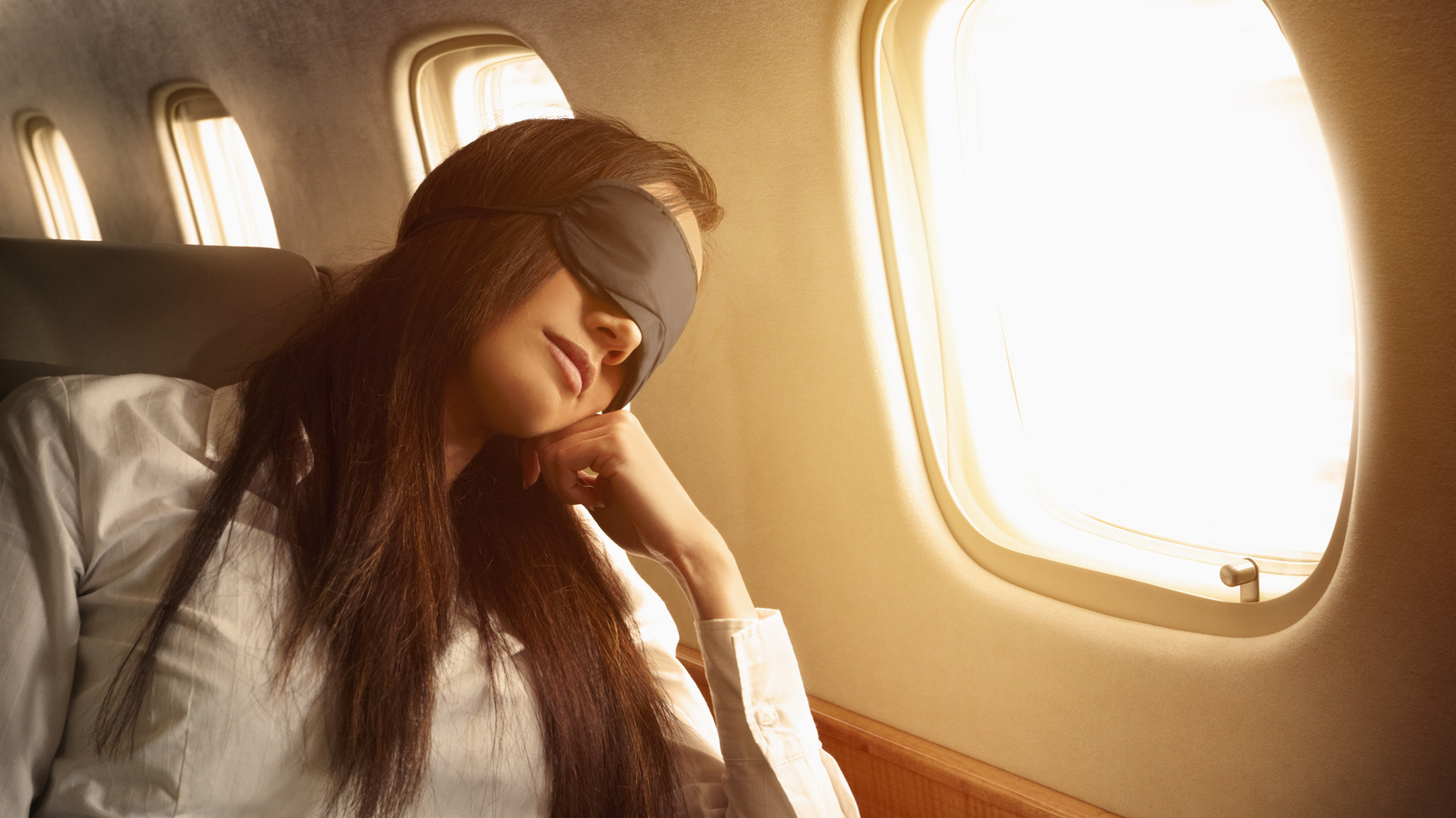 The Most Important Thing To Do Before Falling Asleep On A Plane, Per ...