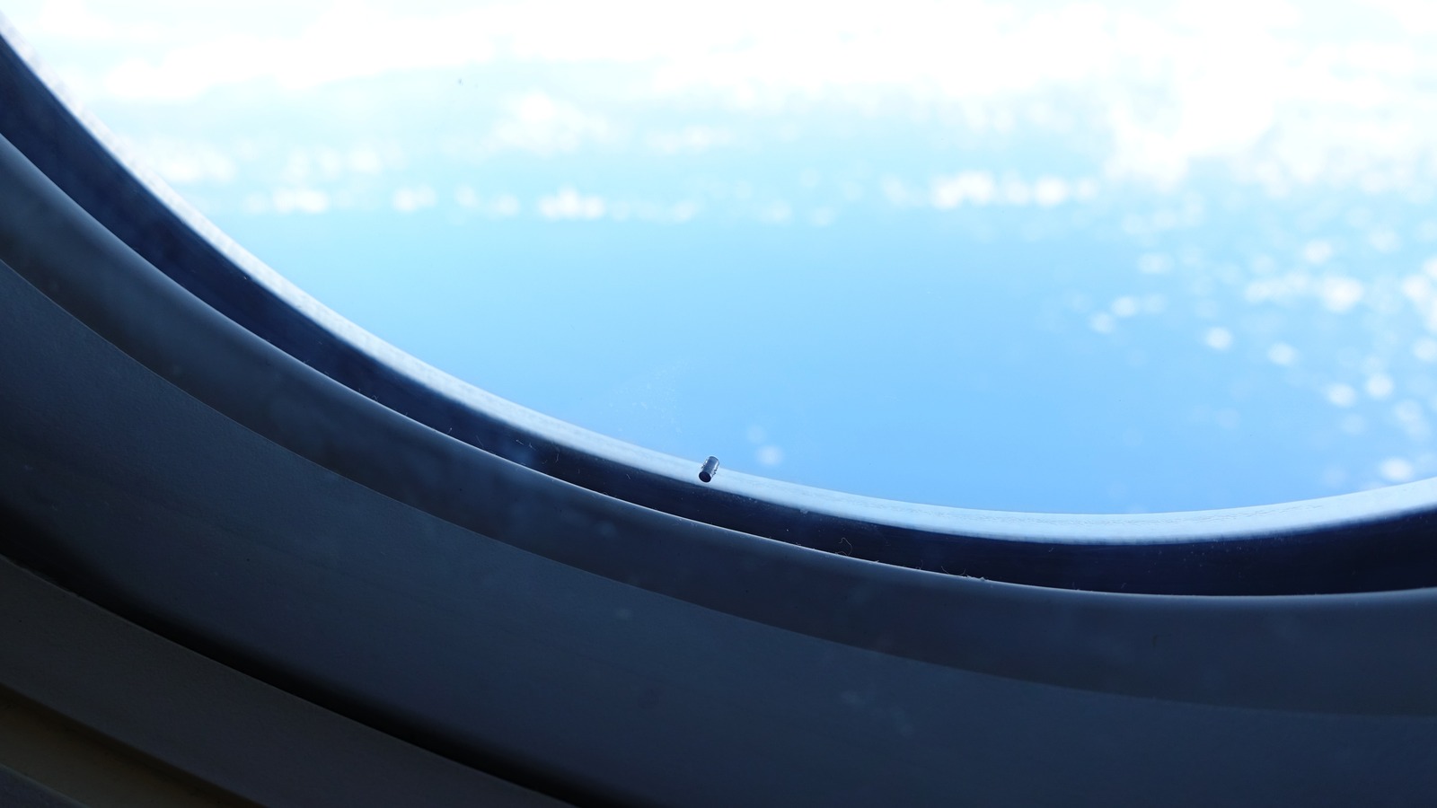 Explore The Purpose Behind The Small Holes In Airplane Widows