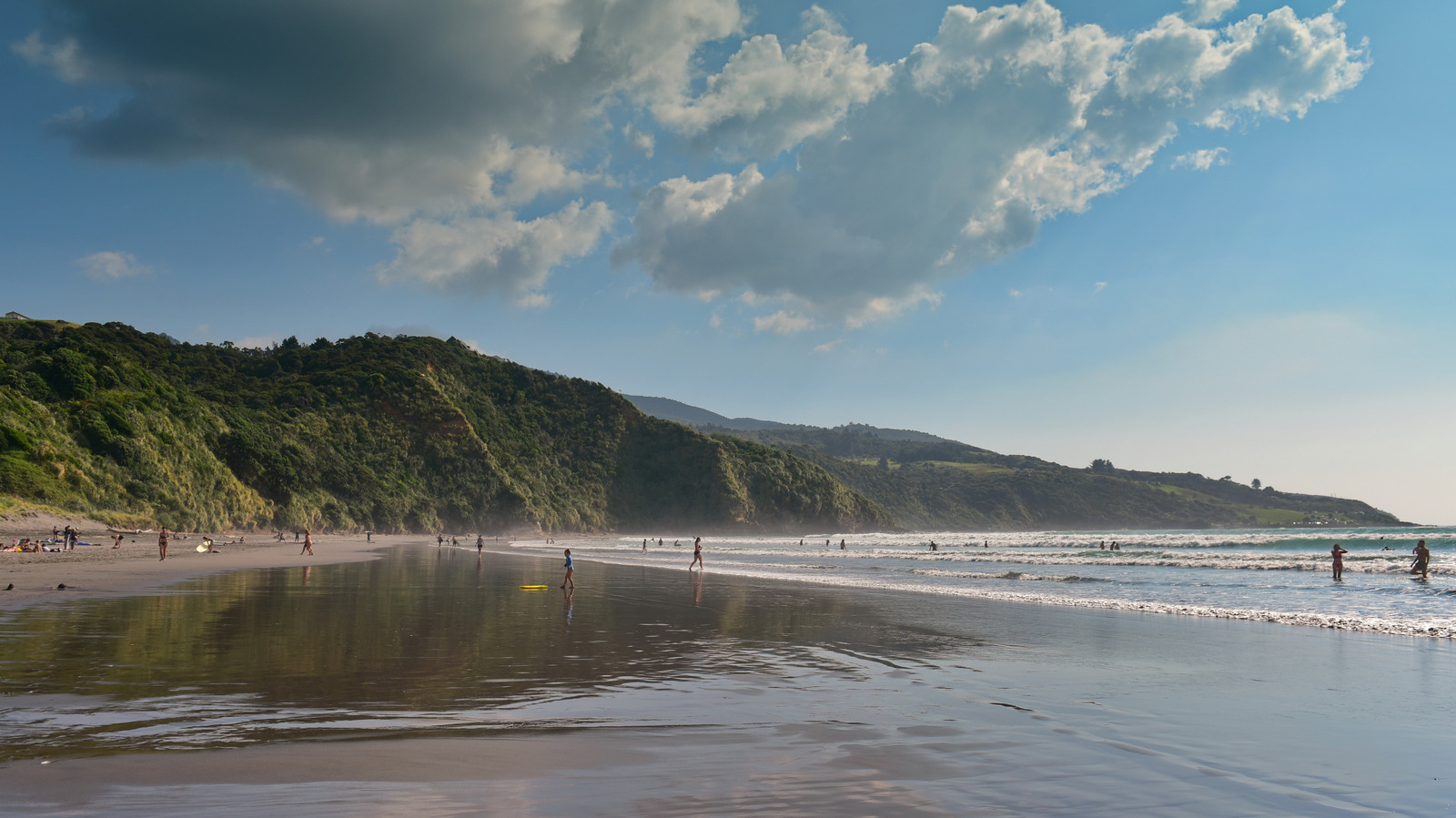 This Laid-Back Surf Town Is A New Zealand Gem With Black Sand Beaches ...
